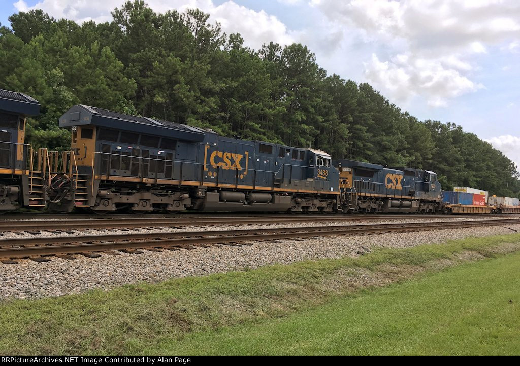 CSX 3318, 3438, and 7920 push a stack train